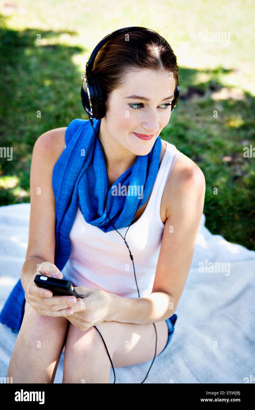 Woman listening to music Stock Photo - Alamy