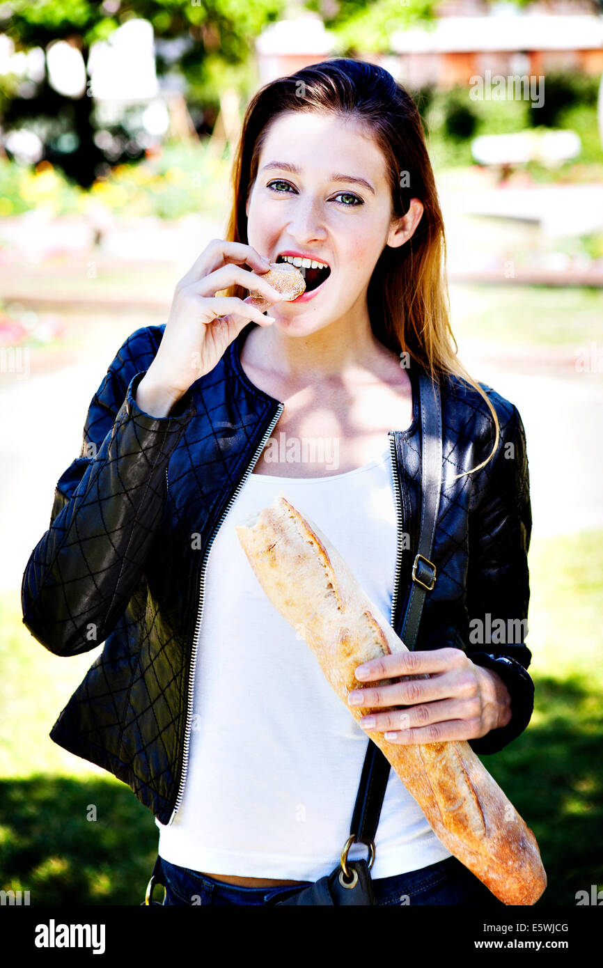 Woman eat bread outdoors hi-res stock photography and images - Alamy