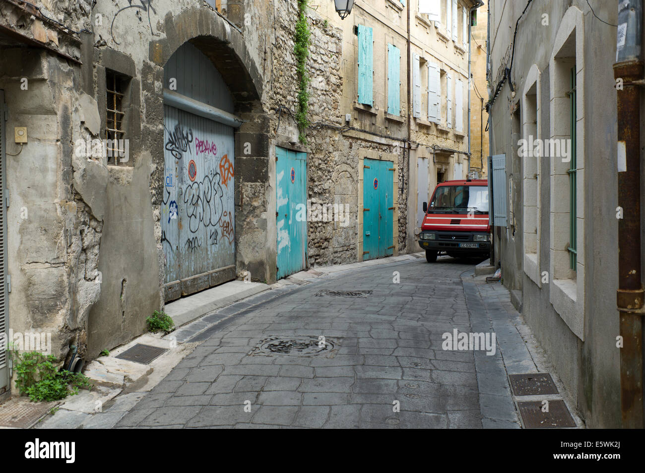 Red van in ancient narrow stone street, Arles, Provence, France Stock ...