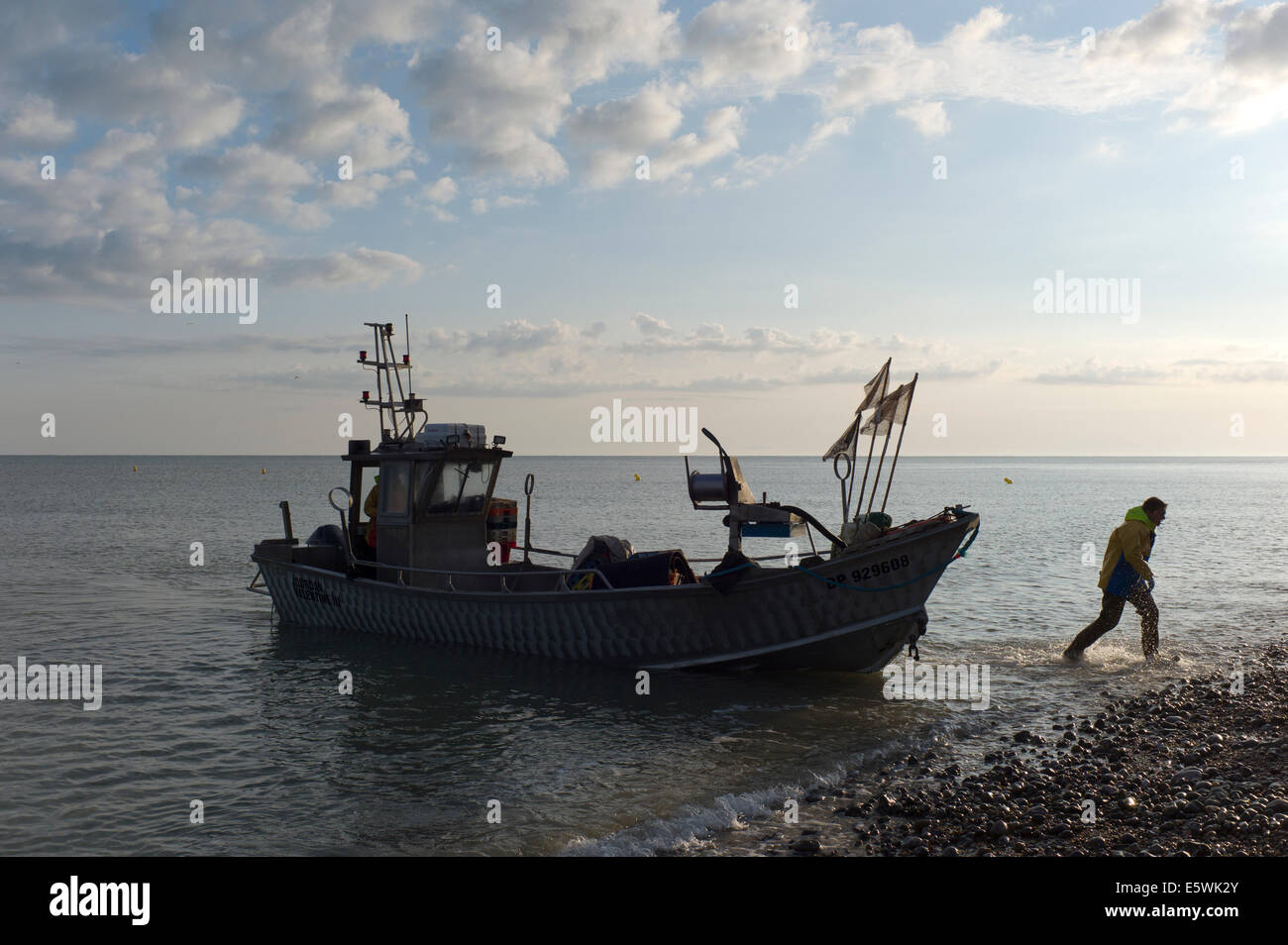 Fishing boat landing on beach, Normandy, France Stock Photo - Alamy