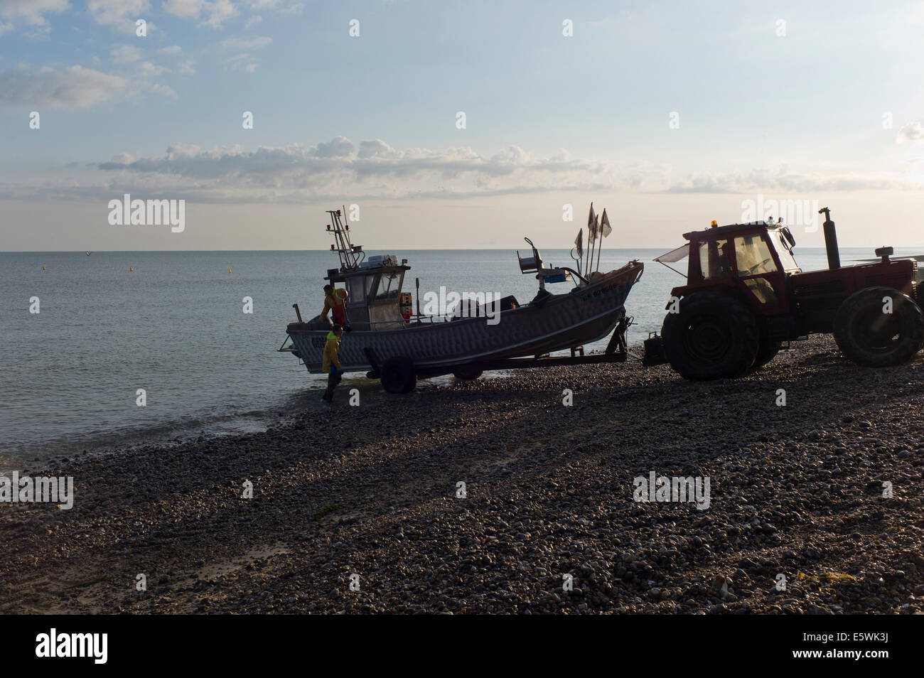 Fishing boat landing on beach, Normandy, France Stock Photo - Alamy