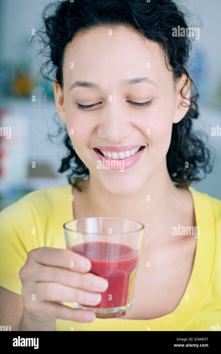 Woman with cold drink Stock Photo - Alamy