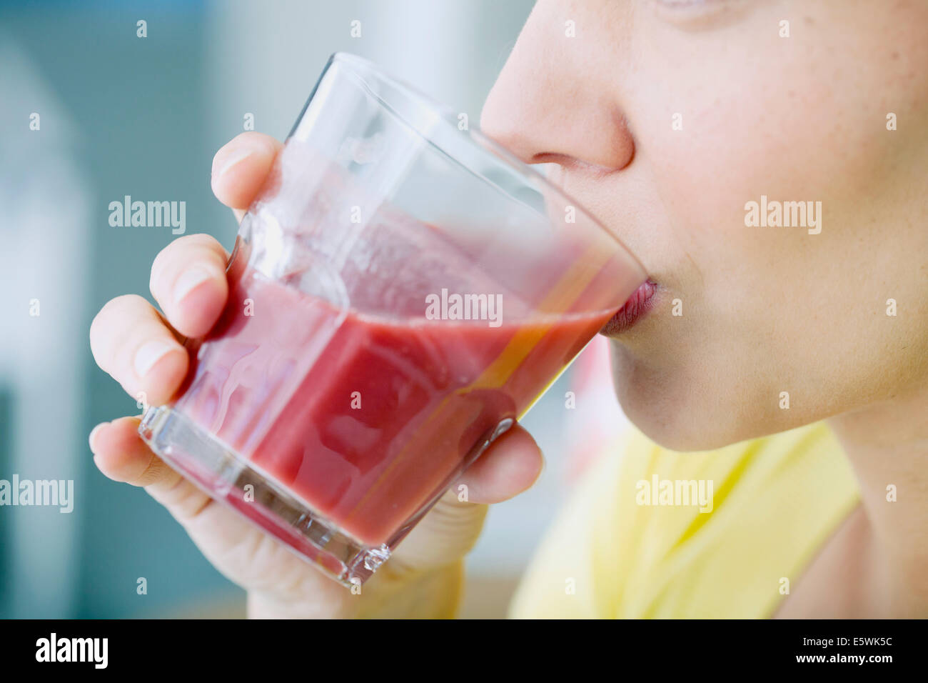 Woman with cold drink Stock Photo - Alamy