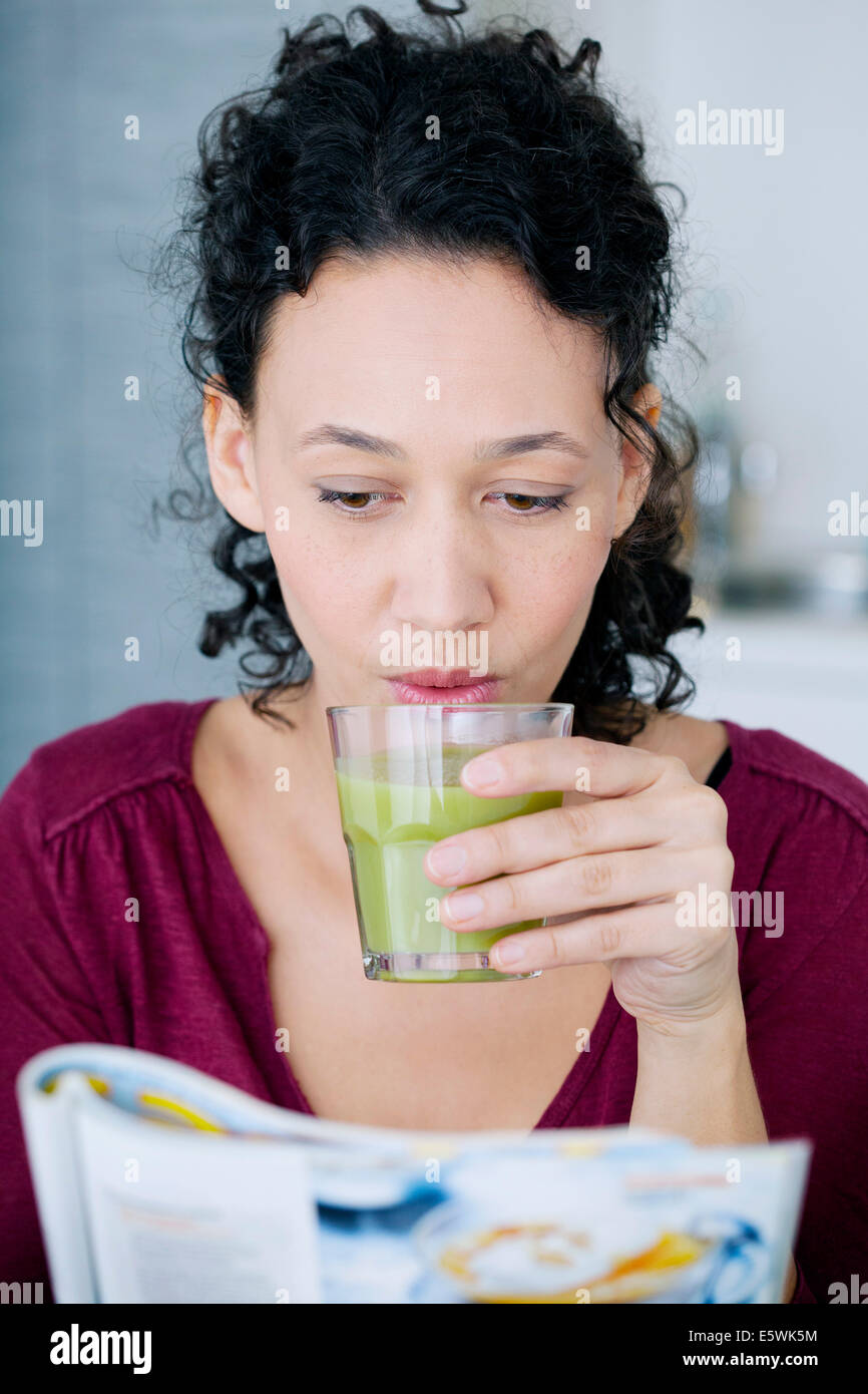 Woman with cold drink Stock Photo - Alamy