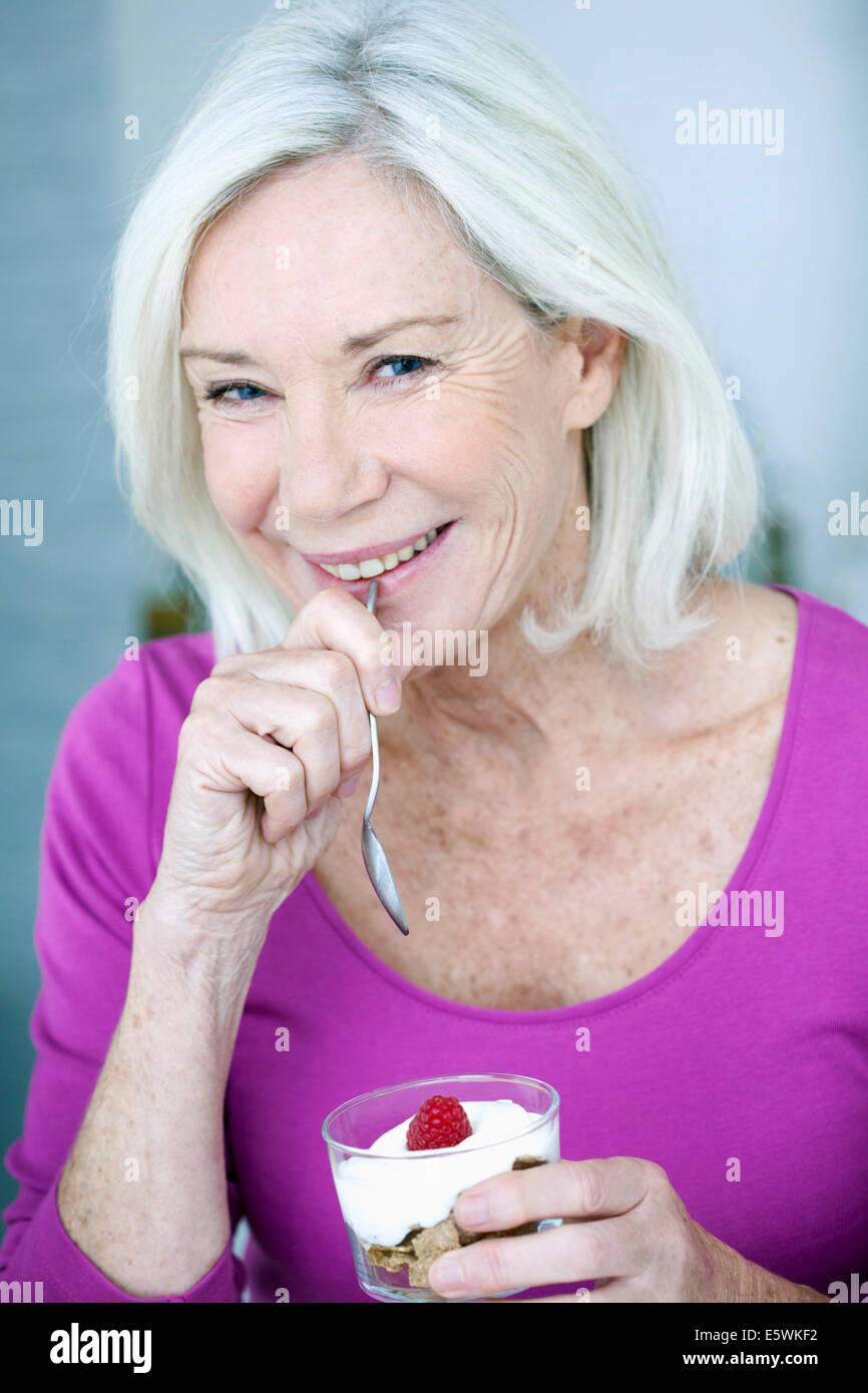 Elderly person snacking Stock Photo - Alamy