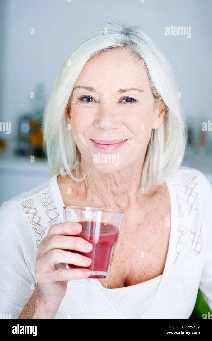 Woman elderly drinking juice hi-res stock photography and images - Alamy
