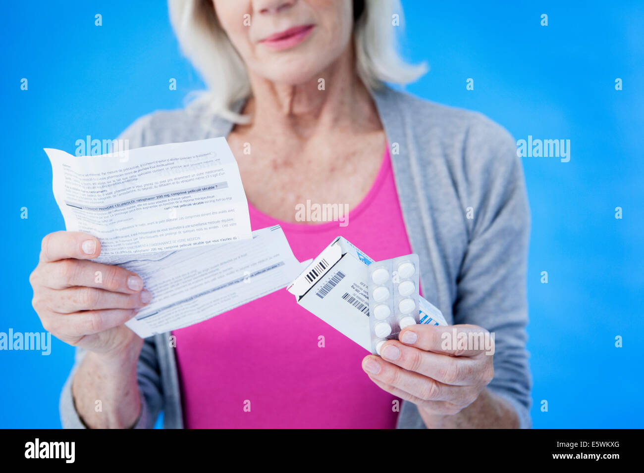Elderly person taking medication Stock Photo - Alamy