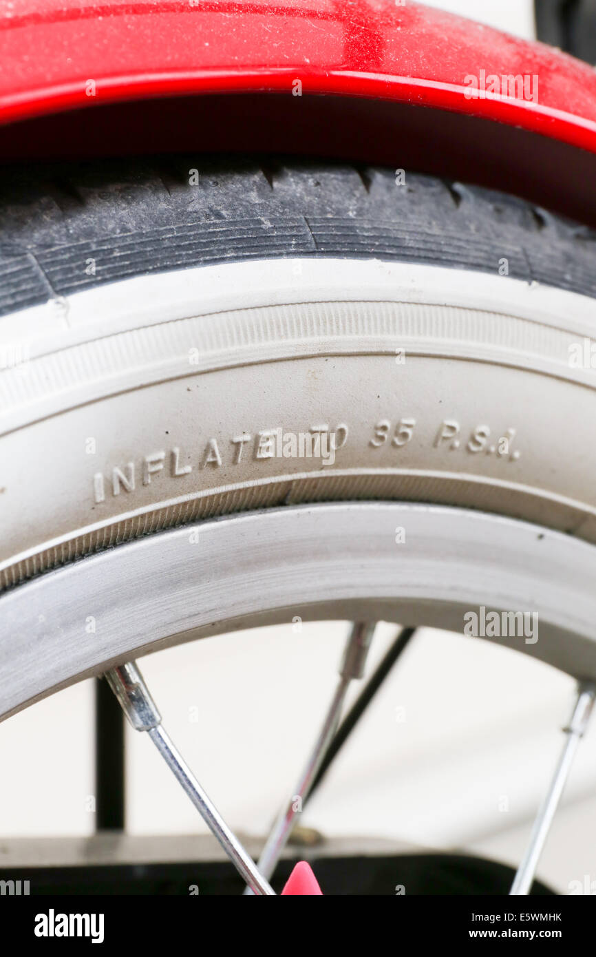 Rear tire on a small red bike Stock Photo - Alamy