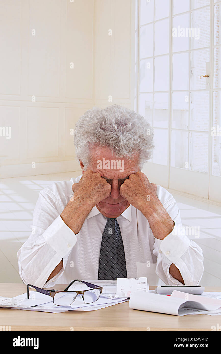 ELDERLY PERSON DOING PAPERWORK Stock Photo - Alamy