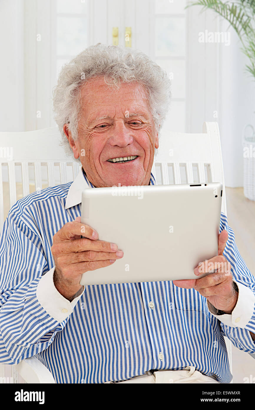 ELDERLY PERSON WITH TABLET Stock Photo - Alamy
