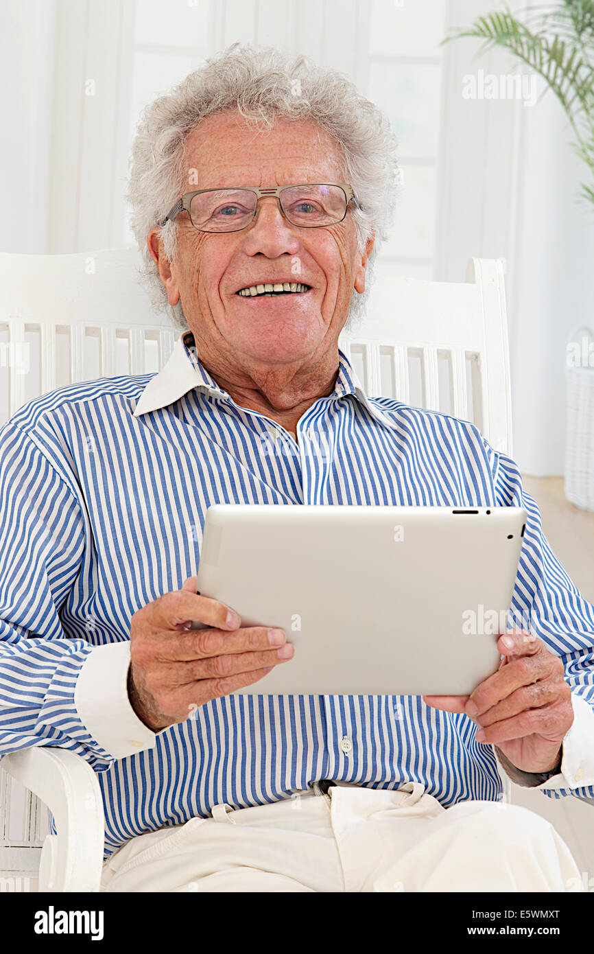 ELDERLY PERSON WITH TABLET Stock Photo - Alamy