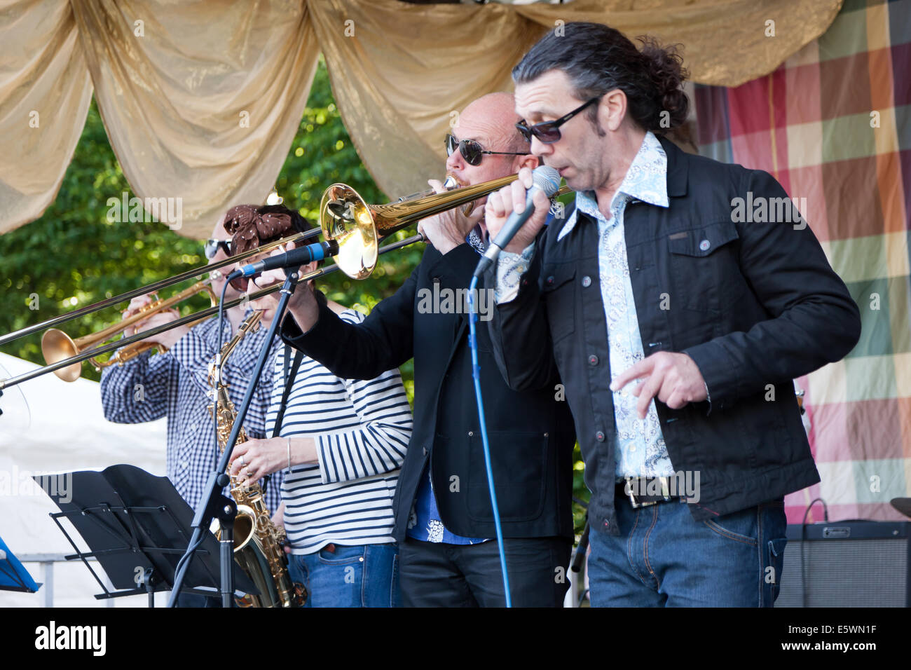 The brass section and the singer of the Hit Men UK, performing at the ...