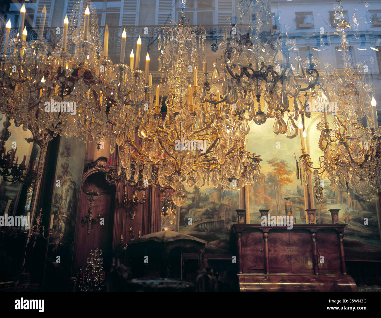 Window view of antiques store with reflection of typical Parisian ...