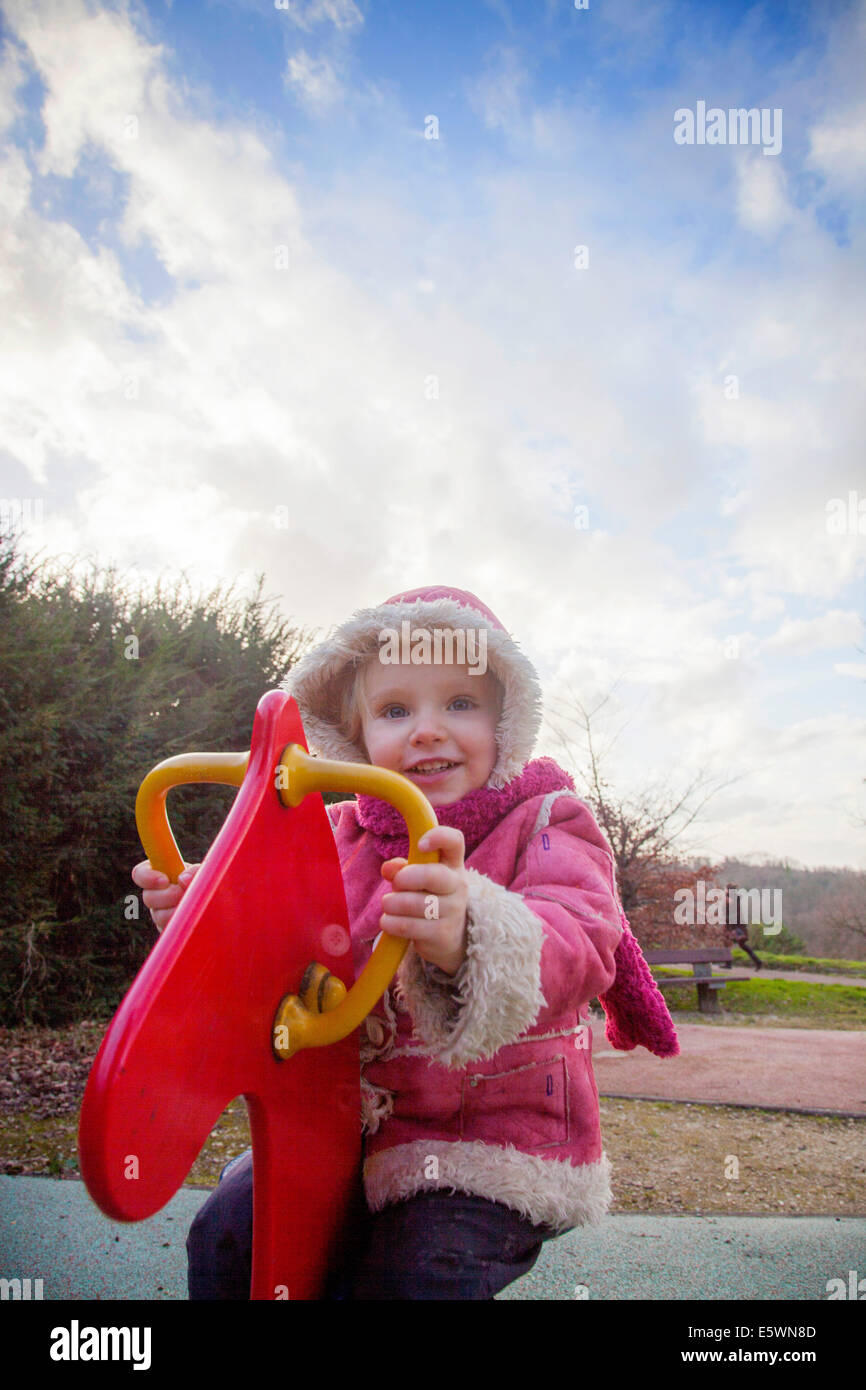 Child playing alone outside hi-res stock photography and images - Alamy