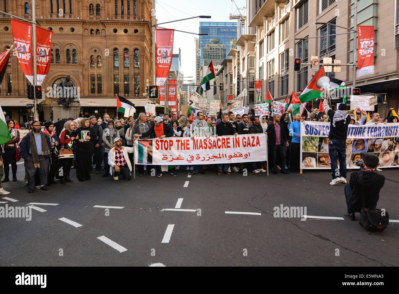 Crowd with Palestine flags and banners in support of Palestine shouts ...