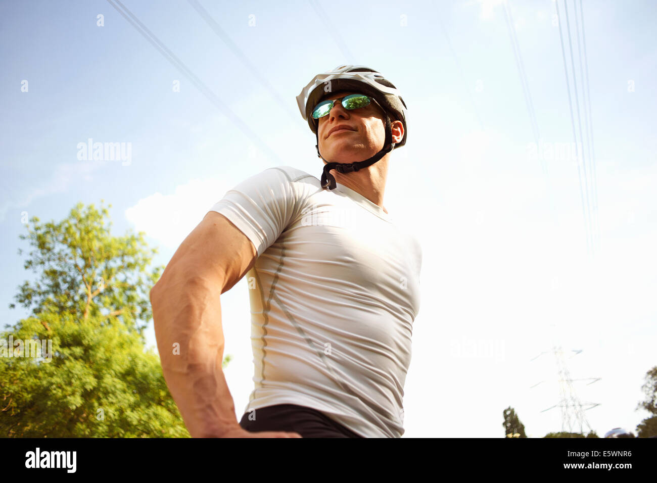 Male cyclist looking over shoulder hi-res stock photography and images ...