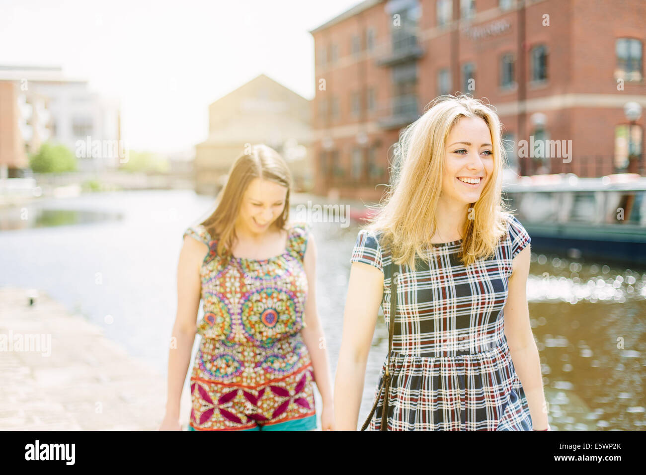 Friends walking by canal, Leeds, England Stock Photo - Alamy