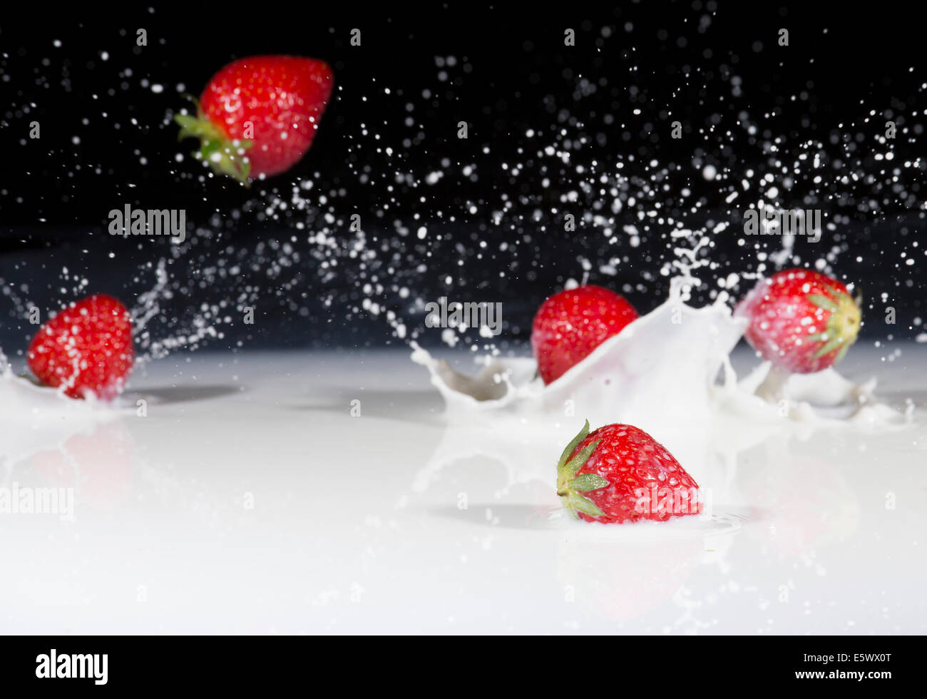 Milk splashing by strawberry hi-res stock photography and images - Alamy