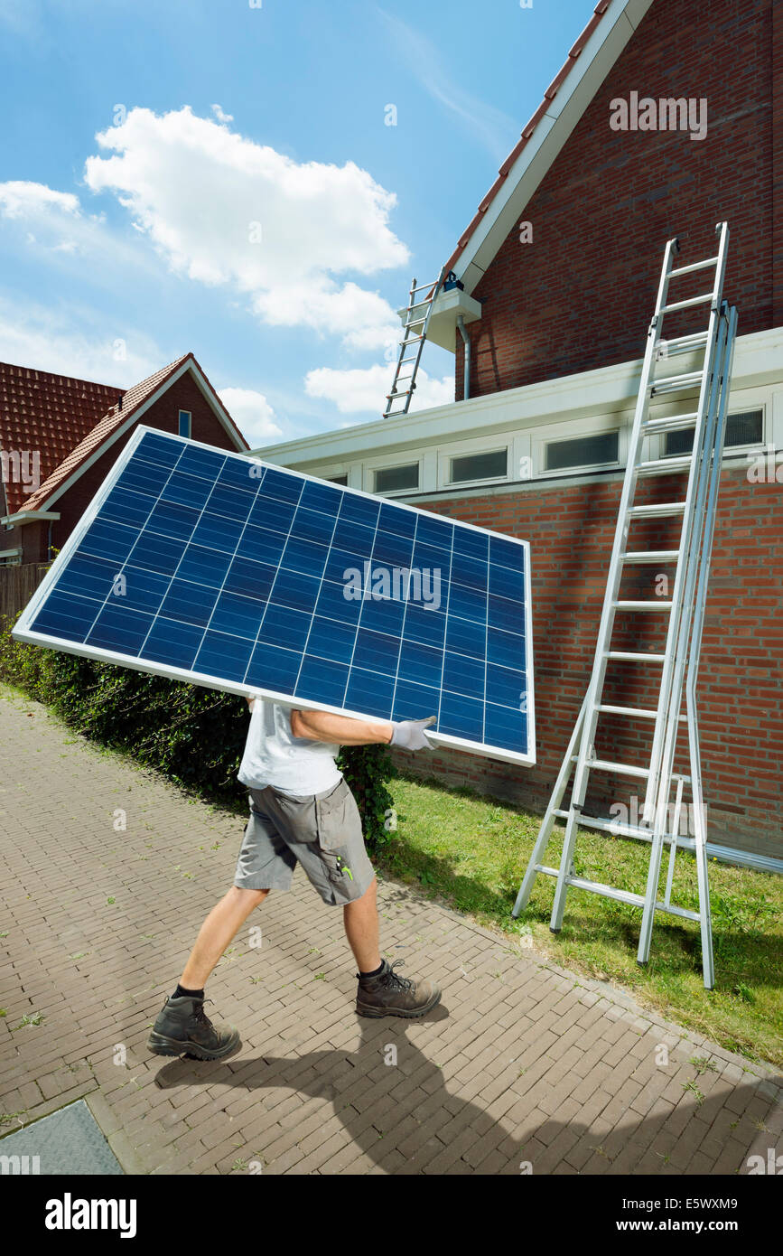 Installing solar panel hi-res stock photography and images - Alamy