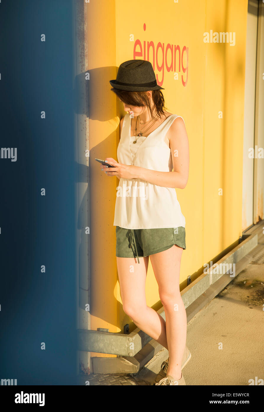 Female leaning on wall hi-res stock photography and images - Alamy