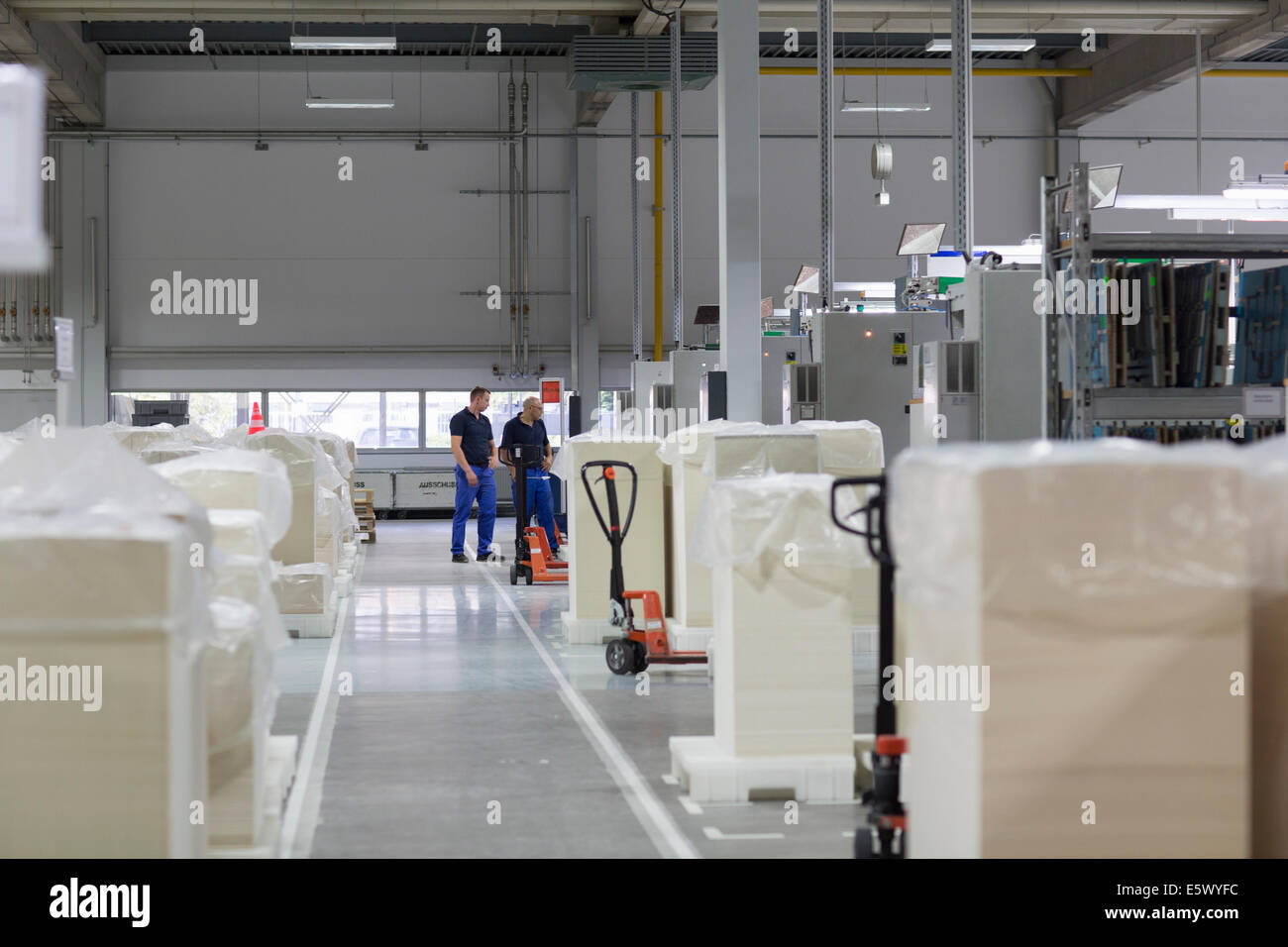 Two workers in paper packaging factory Stock Photo - Alamy