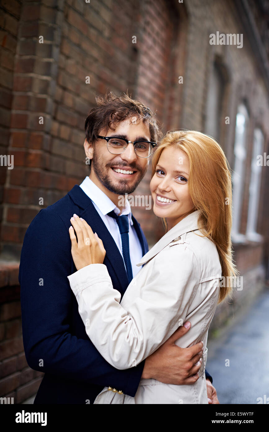Portrait of amorous dates looking at camera with smiles outside Stock ...