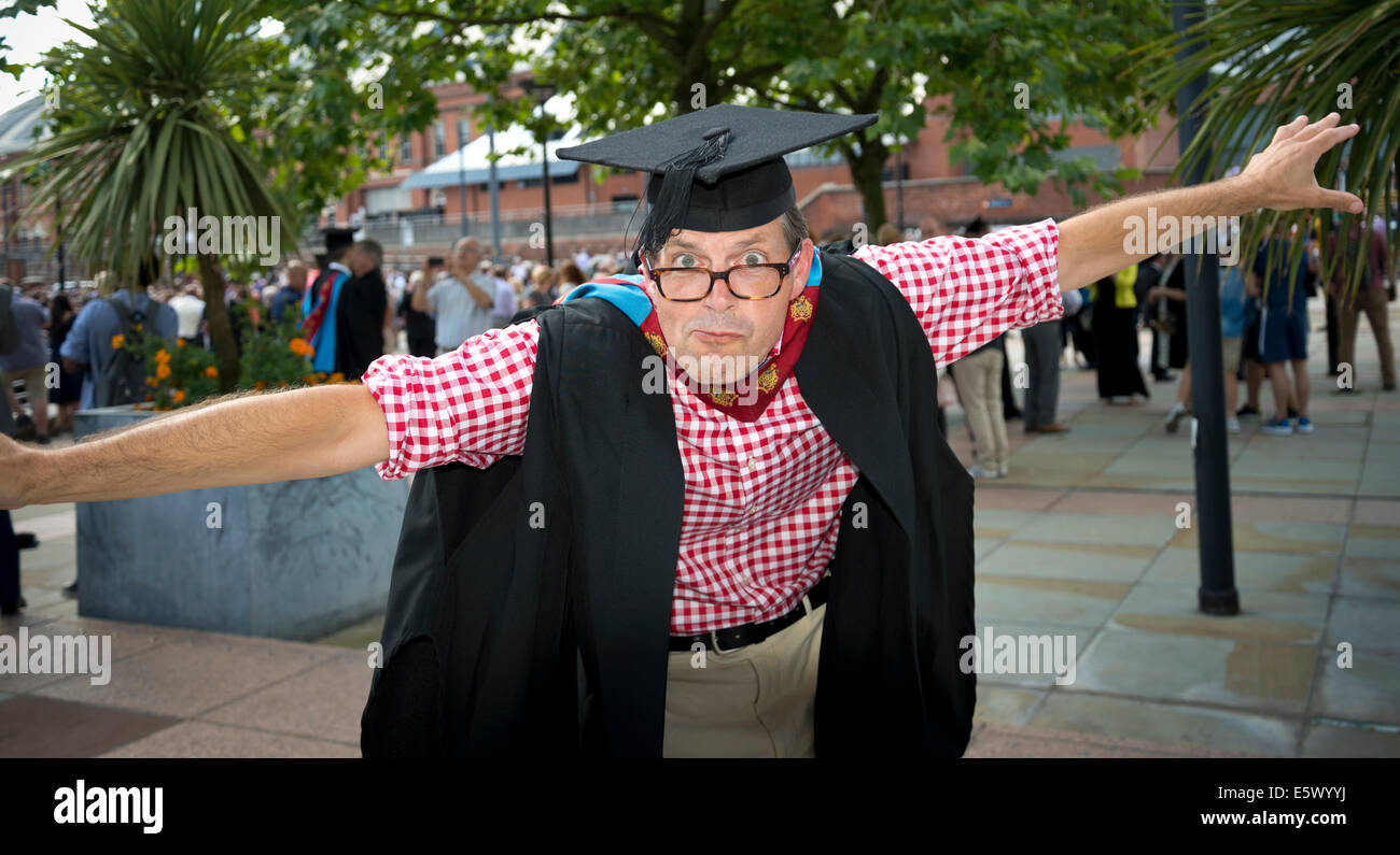Strange looking teacher in gown and mortar board Stock Photo - Alamy
