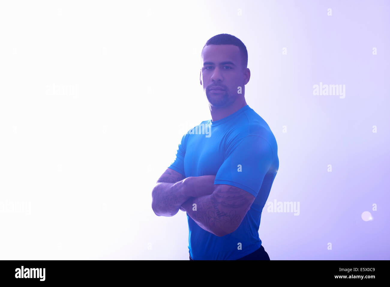 Muscular man crossed arms hi-res stock photography and images - Alamy