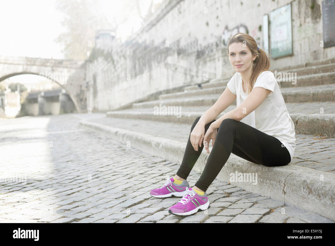 Young woman taking break sitting hi-res stock photography and images ...