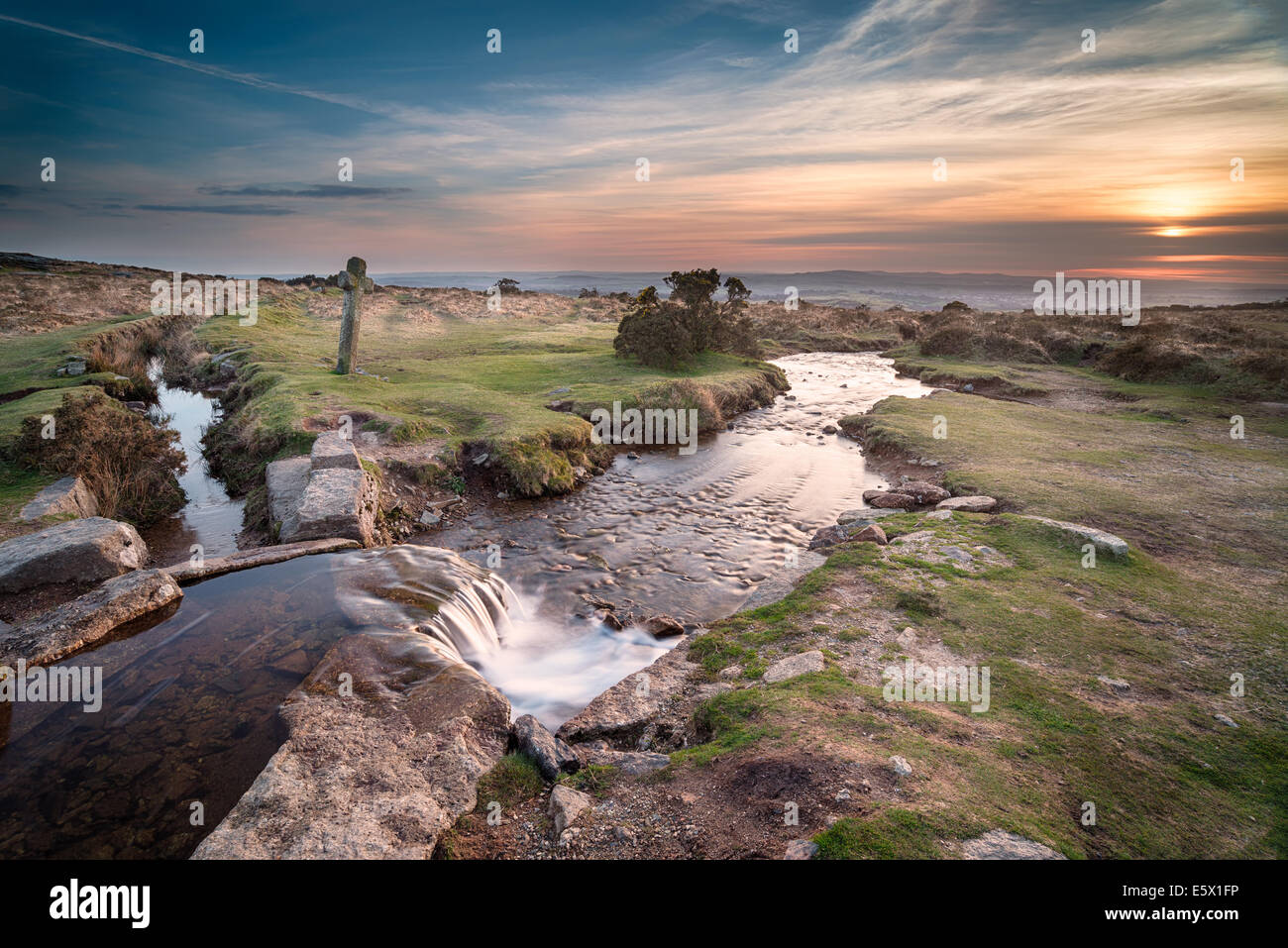 Sunset at Windy Post an ancient granite cross standing alongside the ...