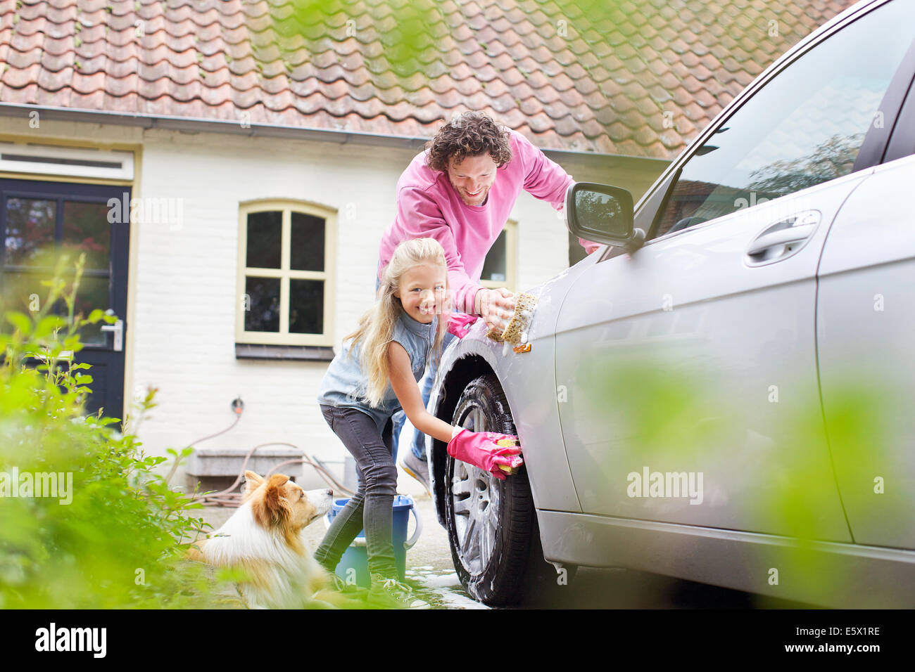 Girl helping father wash his car Stock Photo - Alamy