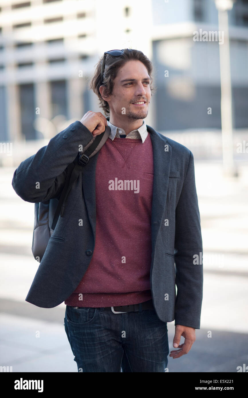 Mid adult man walking in city Stock Photo - Alamy