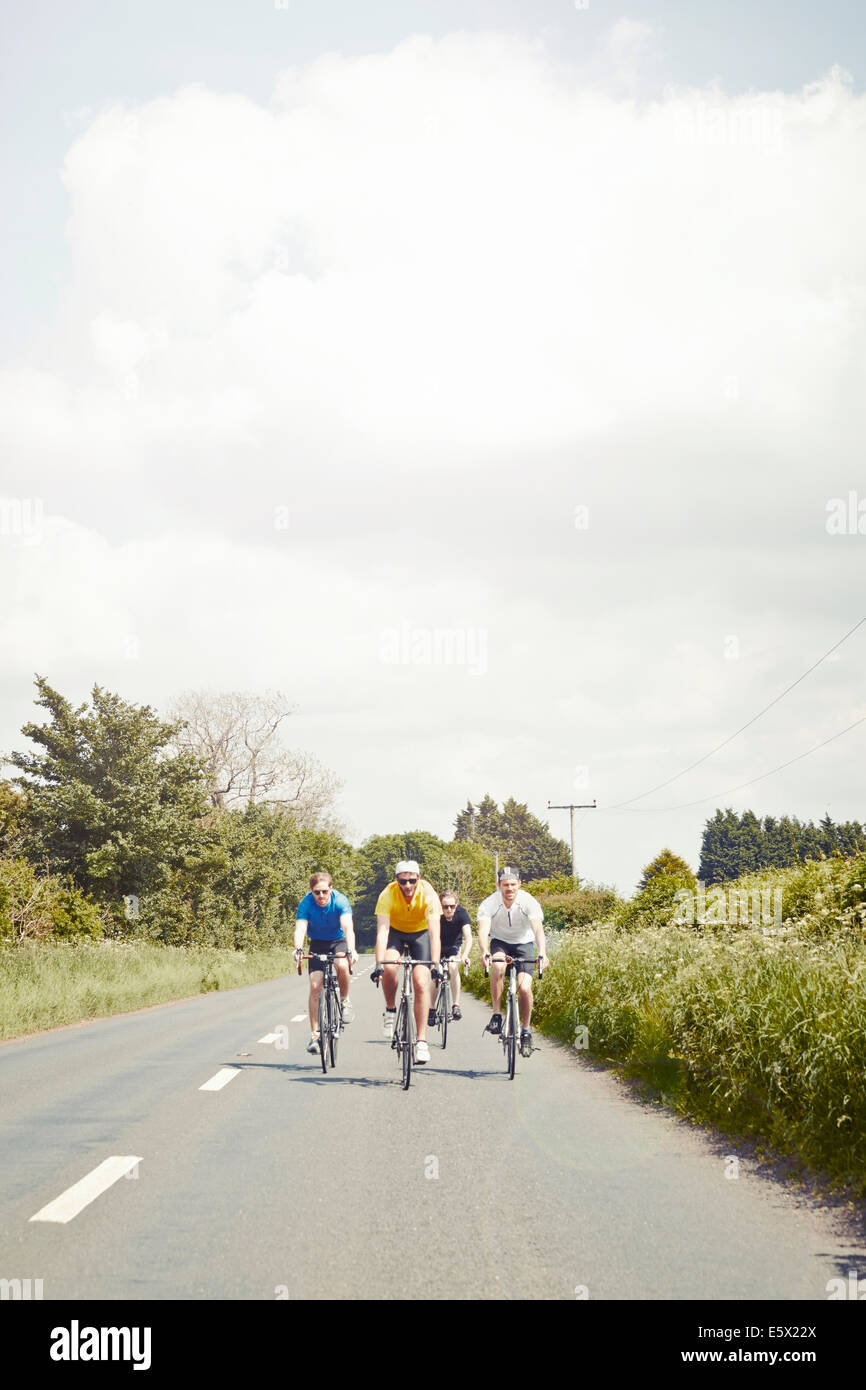 Cyclists riding on single carriageway, Cotswolds, UK Stock Photo - Alamy