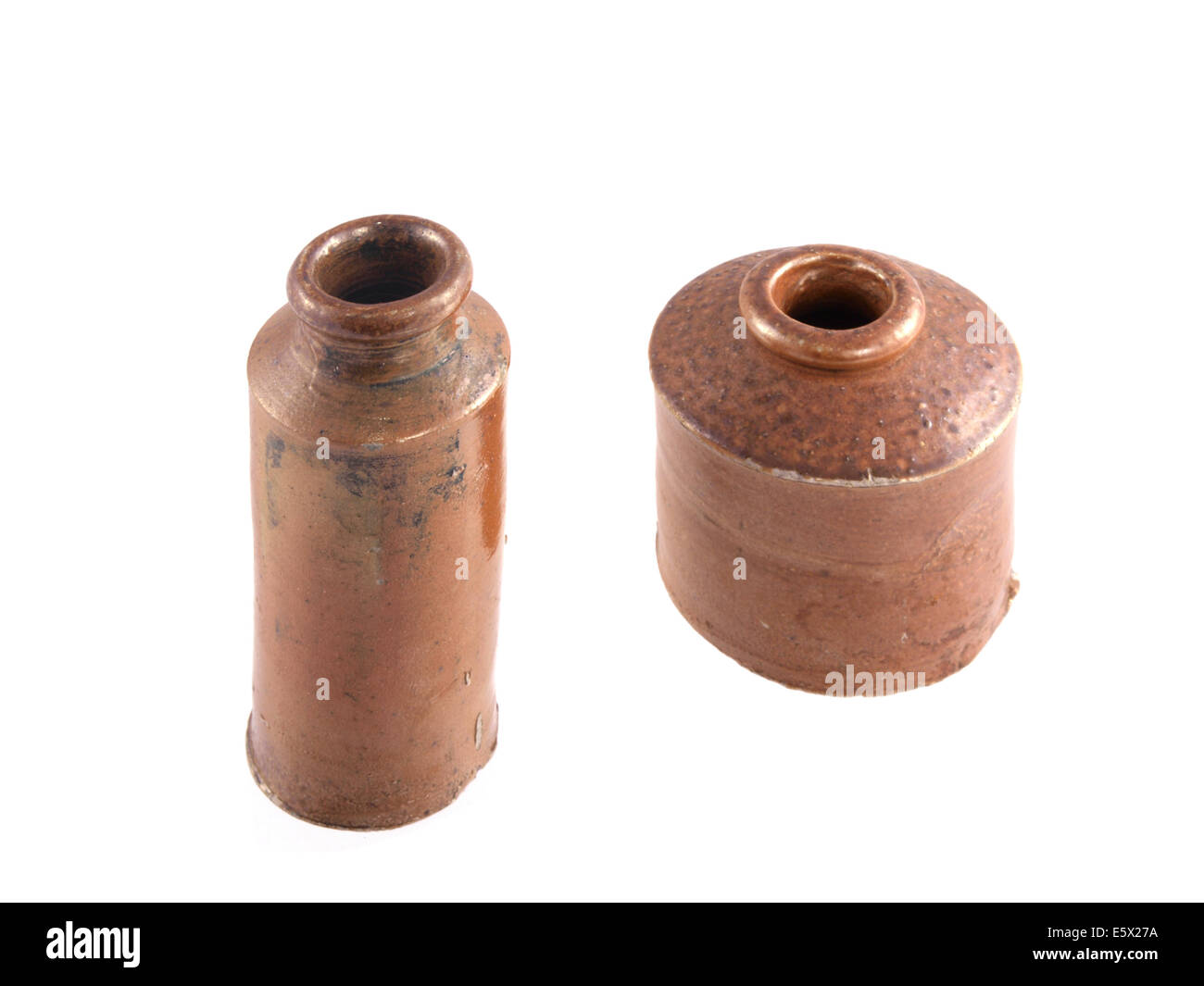 Vintage clay ink wells on a white background Stock Photo - Alamy