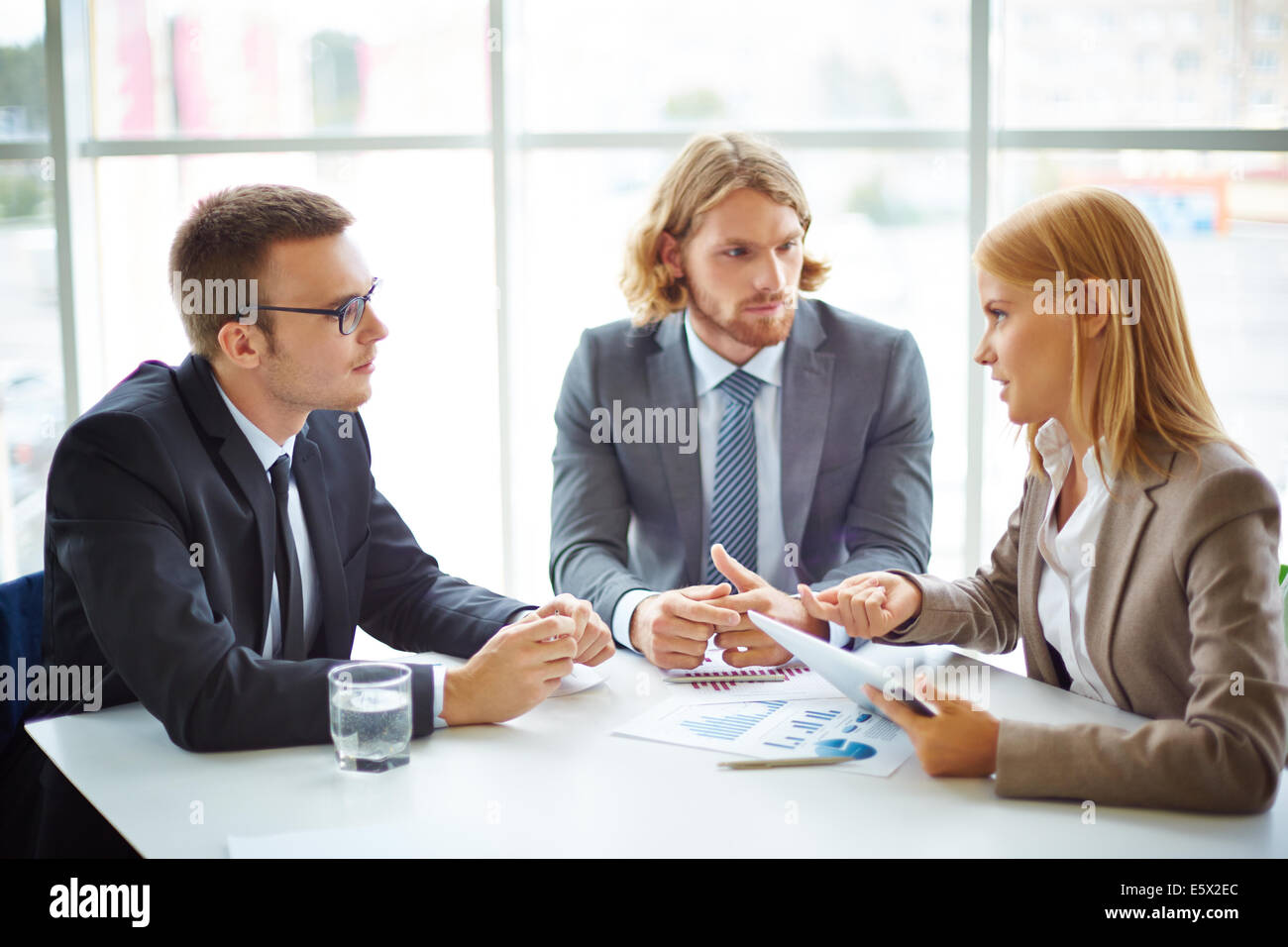 Serious male employee listening hi-res stock photography and images - Alamy