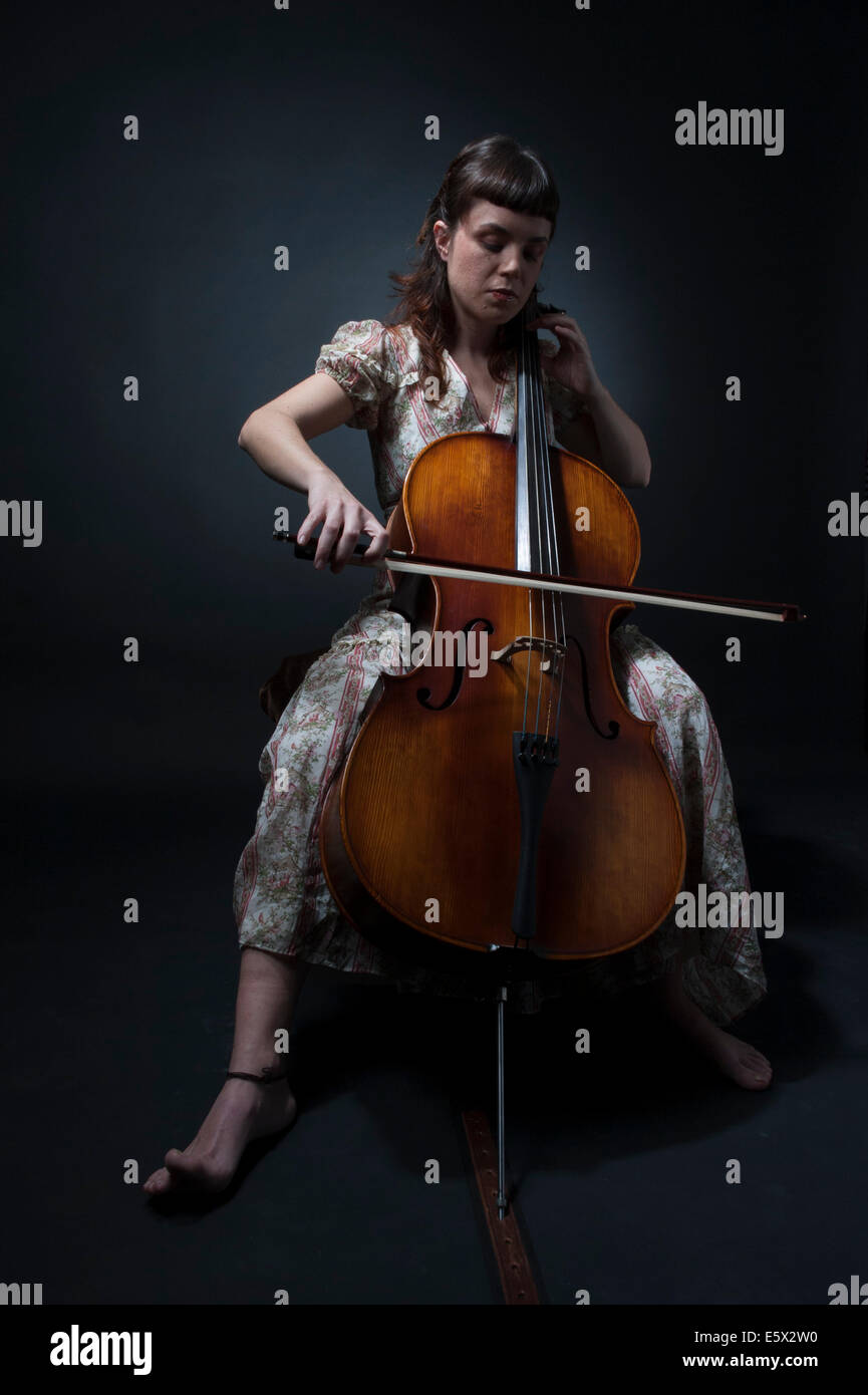 young woman playing cello Stock Photo - Alamy