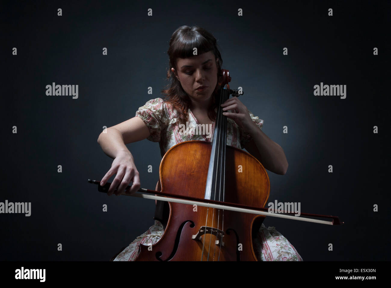 young woman playing cello Stock Photo - Alamy