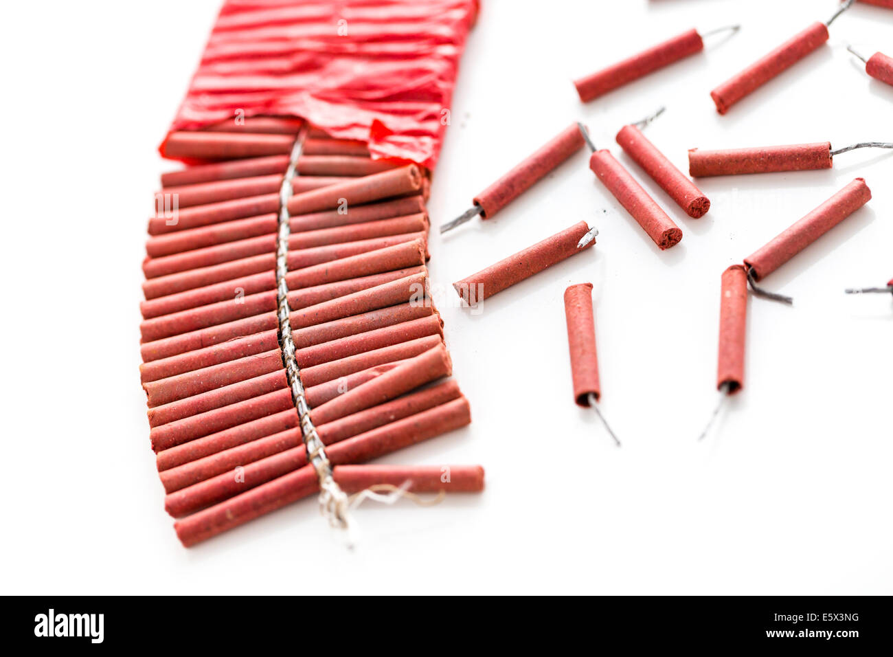 Roll of firecrackers on a white background Stock Photo - Alamy