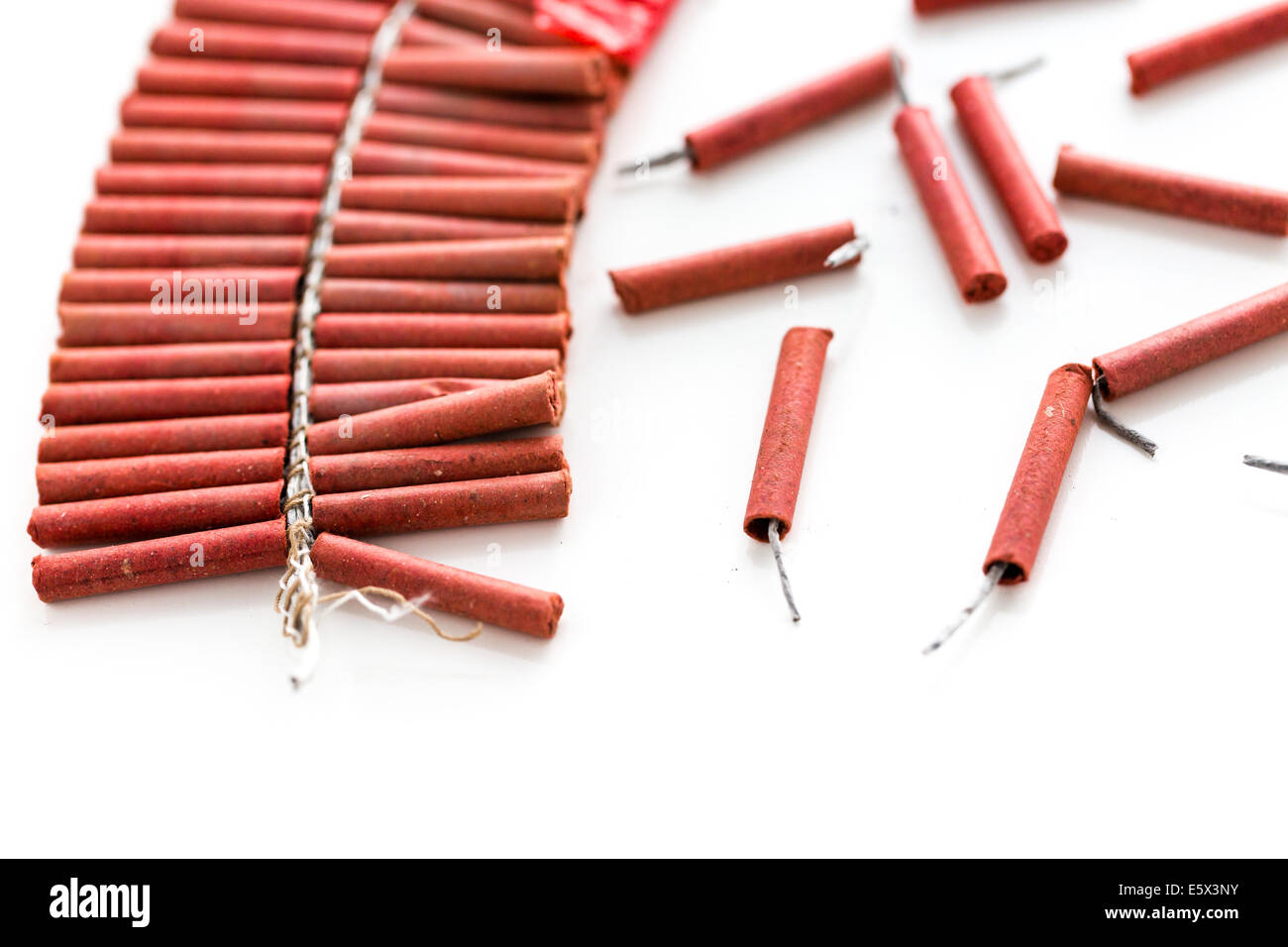 Roll of firecrackers on a white background Stock Photo - Alamy