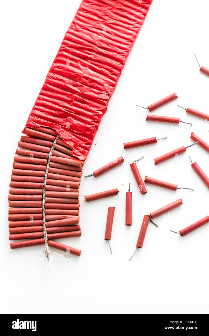 Roll of firecrackers on a white background Stock Photo - Alamy