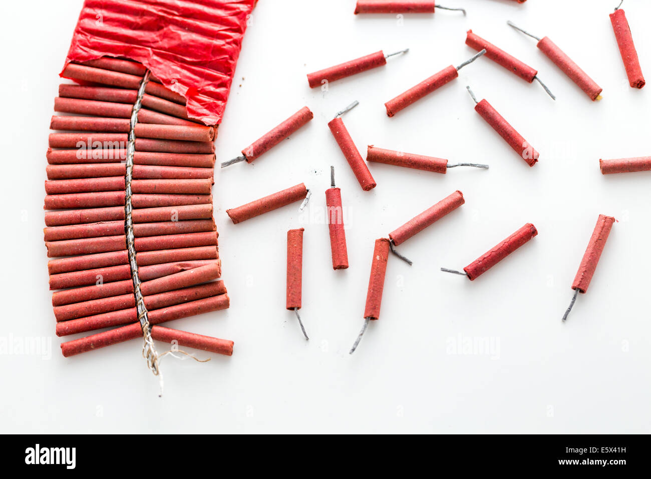 Roll of firecrackers on a white background Stock Photo - Alamy