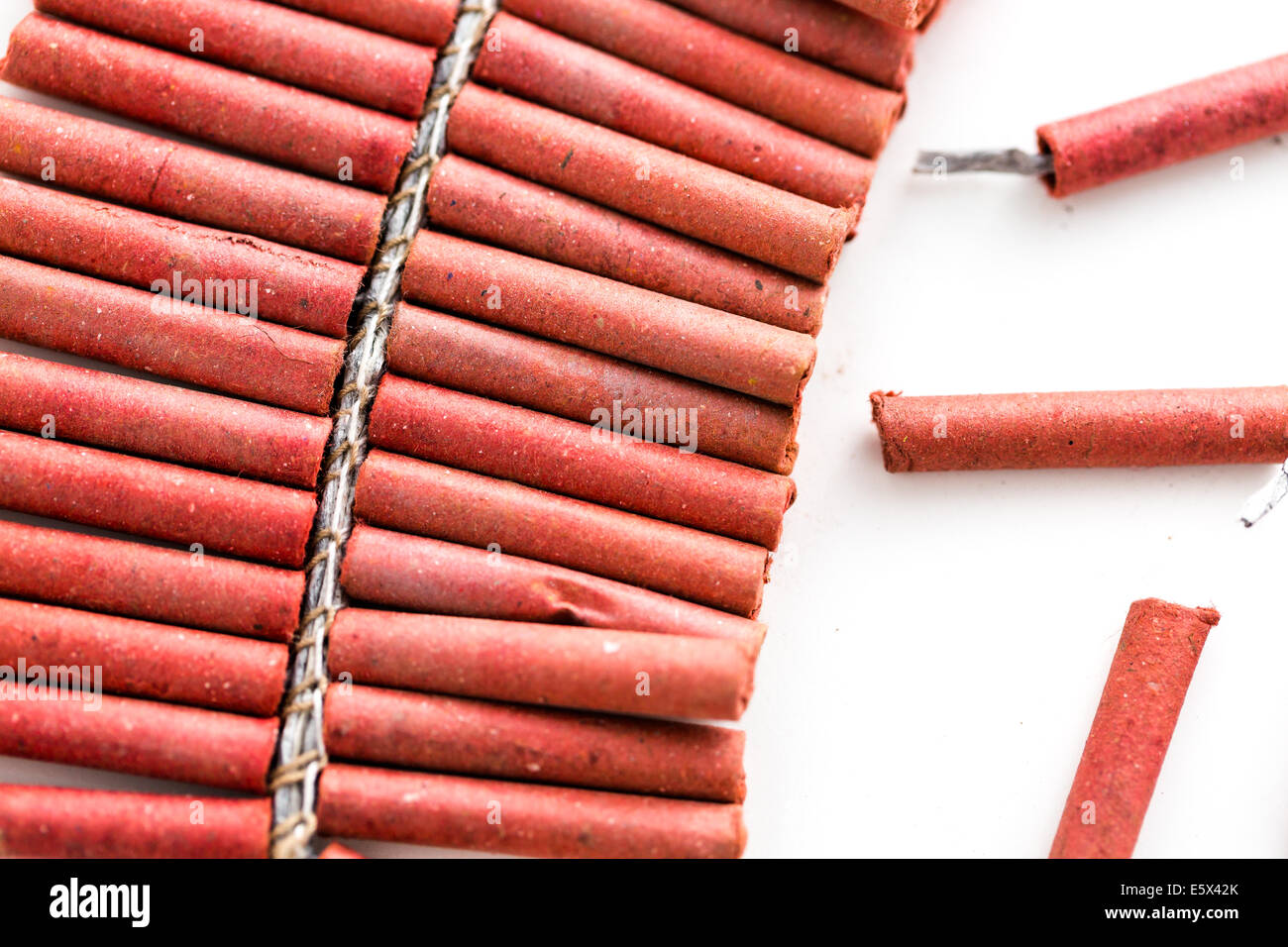 Roll of firecrackers on a white background Stock Photo - Alamy