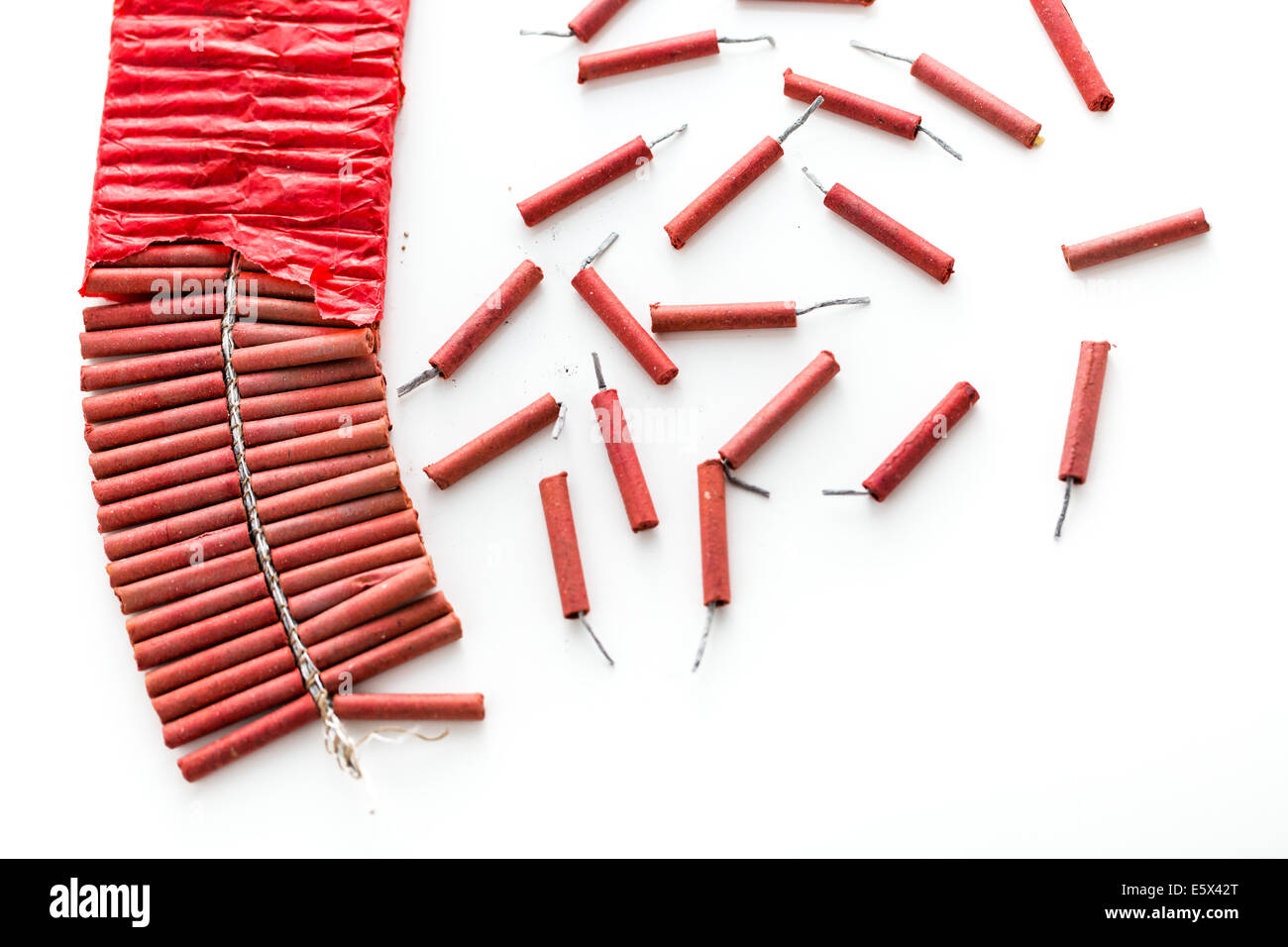 Roll of firecrackers on a white background Stock Photo - Alamy