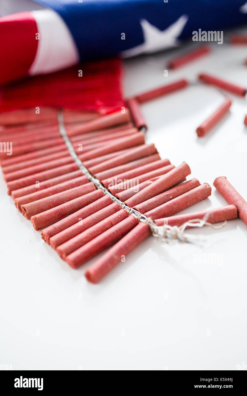Roll of firecrackers with American flag on a white background Stock ...