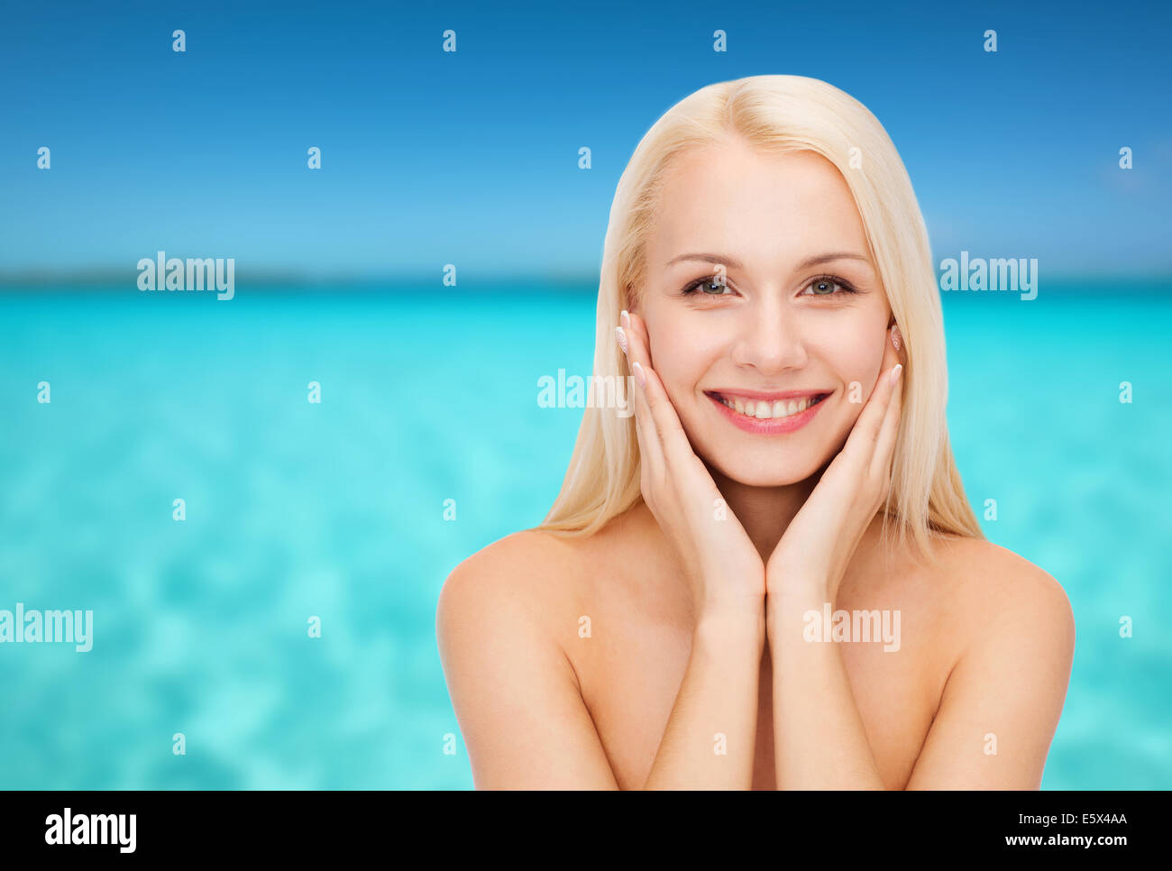 beautiful woman touching her face skin Stock Photo - Alamy