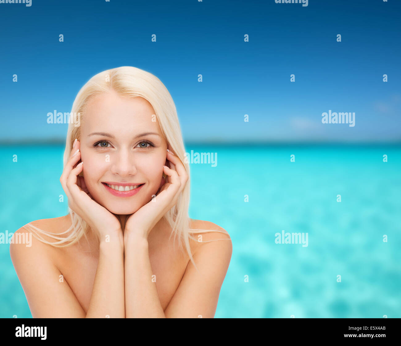 beautiful woman touching her face skin Stock Photo - Alamy