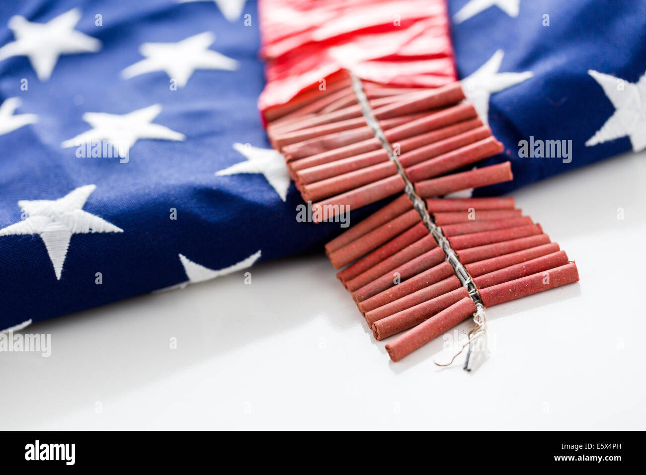 Roll of firecrackers with American flag on a white background Stock ...