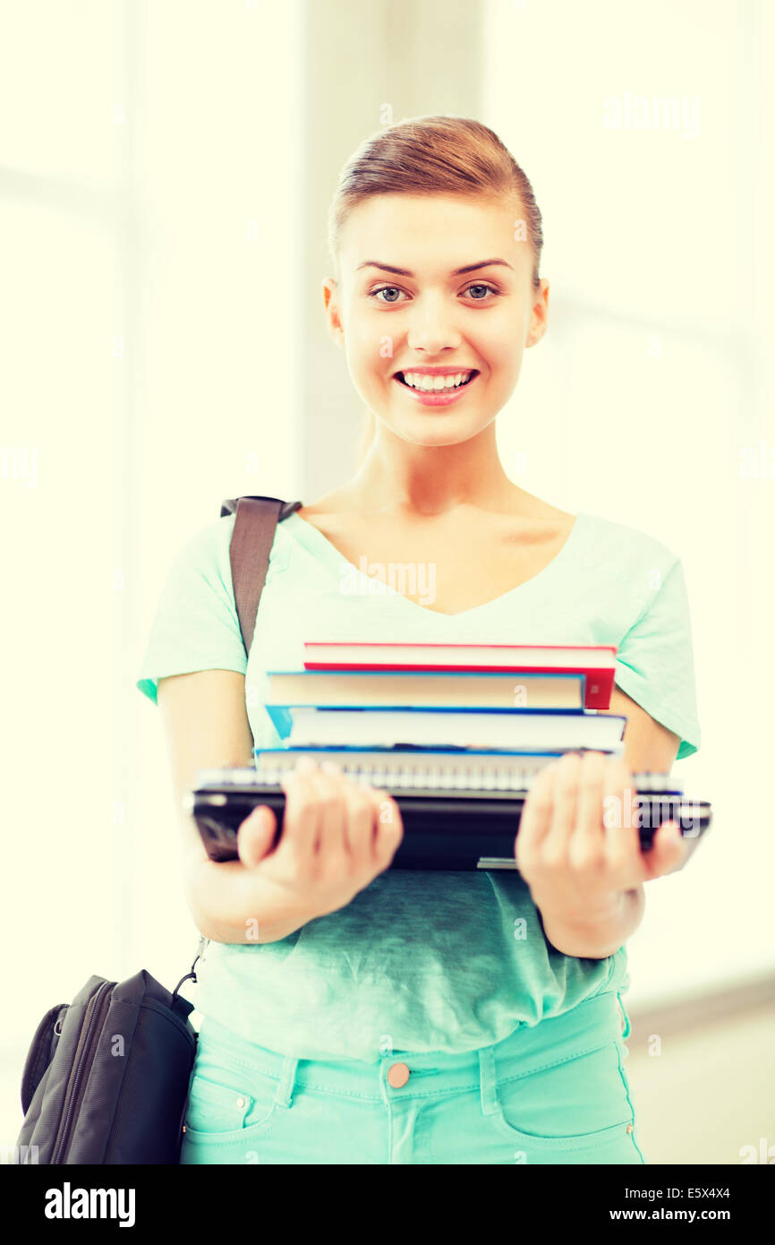 student with folders and school bag in college Stock Photo - Alamy