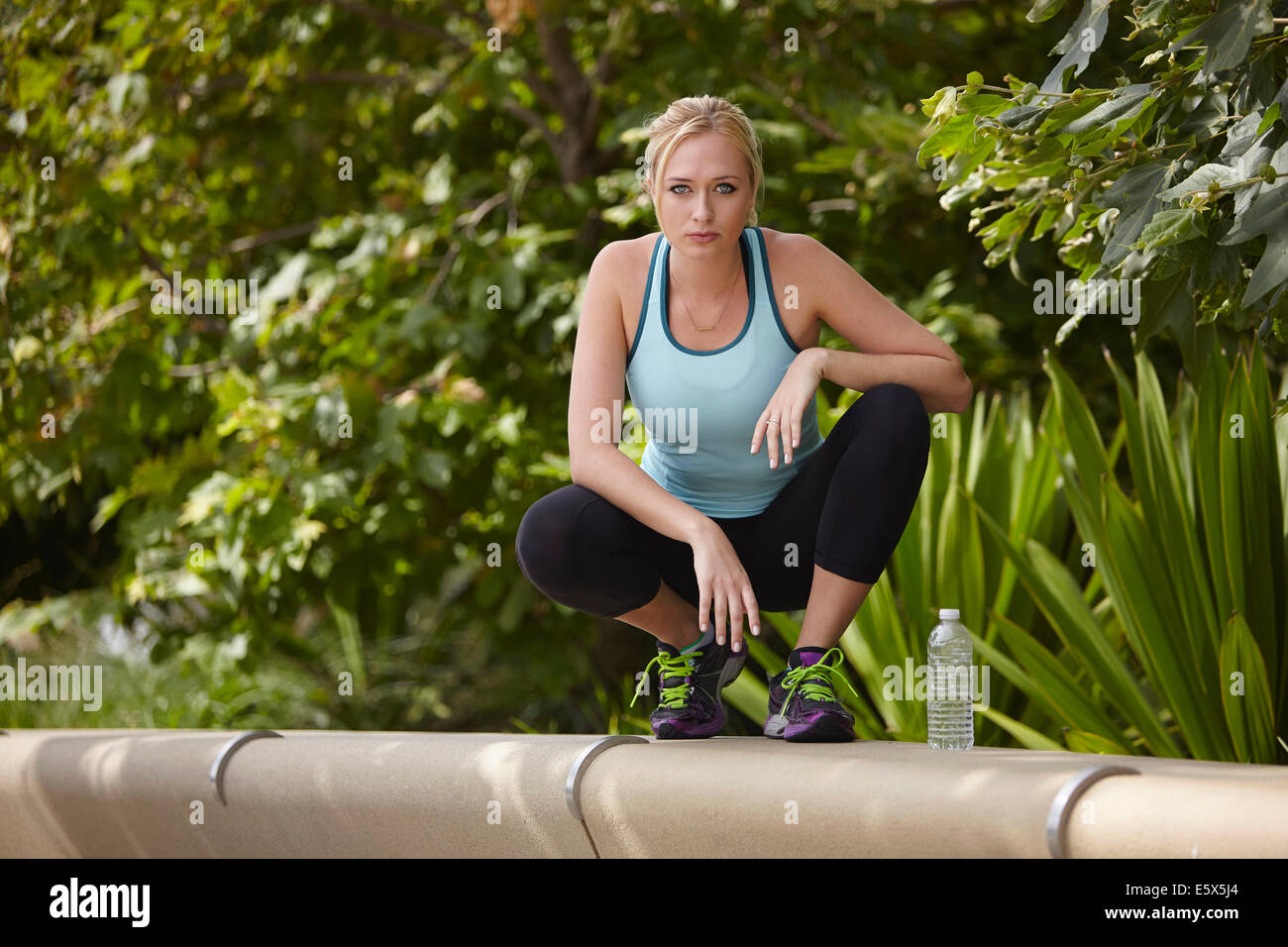 Women squatting hi-res stock photography and images - Alamy