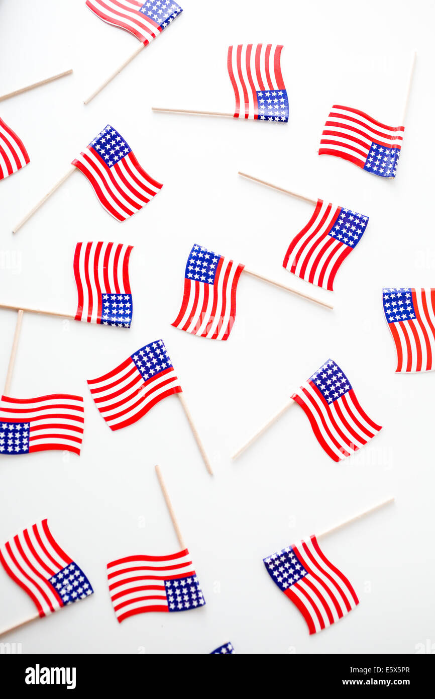 Small paper American Flags on a white background Stock Photo - Alamy